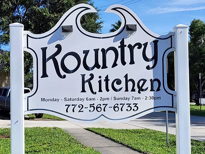 The bold black lettering of Kountry Kitchen’s classic sign stands proudly against the Florida sunshine, inviting early risers to step inside for a hearty homestyle breakfast.