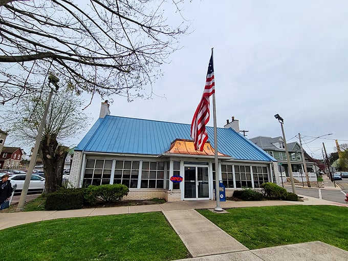 The iconic blue roof and American flag welcome hungry travelers like a breakfast beacon on the Pennsylvania horizon.