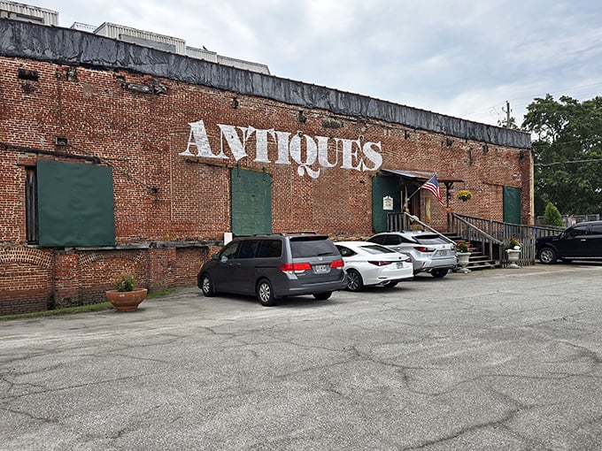 The brick exterior boldly announces "ANTIQUES" like a time-travel invitation written in giant letters. No DeLorean required—just an appreciation for history and comfortable walking shoes.