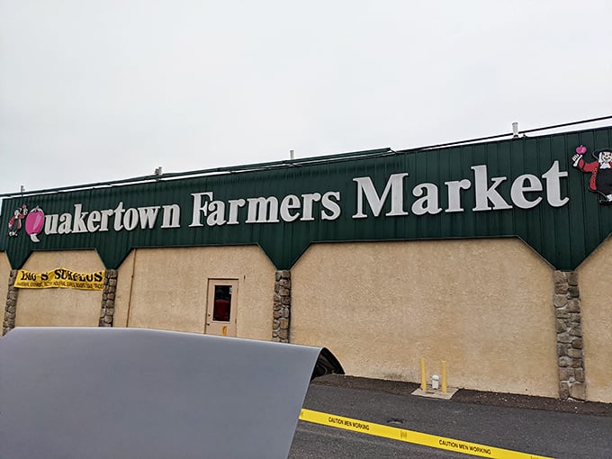 The iconic green signage welcomes bargain hunters and foodies alike. This unassuming exterior hides a wonderland of treasures waiting to be discovered.
