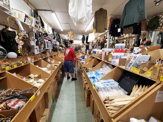 Navigate narrow aisles packed with everything from fishing lures to flashlights—a hardware store fever dream where organization meets controlled chaos.