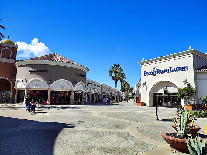 Spanish-style architecture under perfect San Diego skies – Coach and Polo Ralph Lauren face off in a battle of discounted luxury that everyone wins.