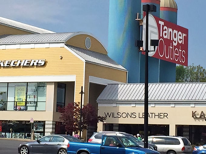The iconic Tanger Outlets sign welcomes bargain hunters to a retail wonderland where wallets tremble but spirits soar.