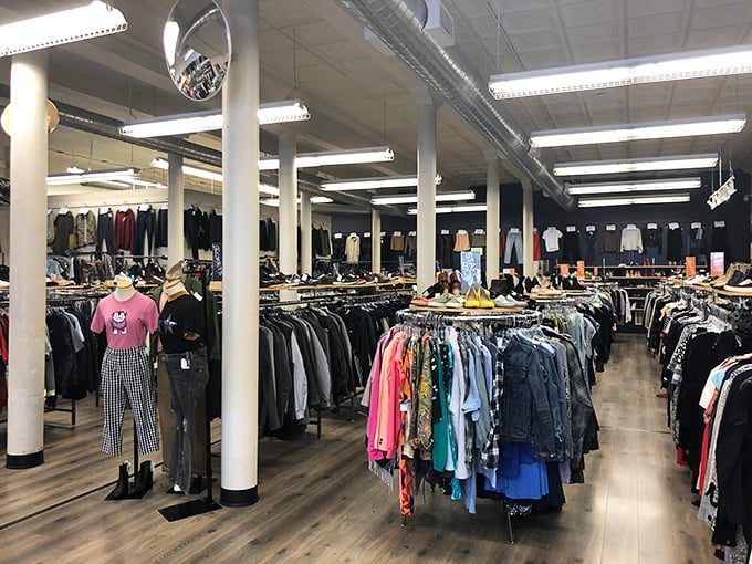 The navy blue storefront with orange-trimmed windows stands like a fashion oasis on Market Street, beckoning style-seekers with promises of hidden treasures inside.