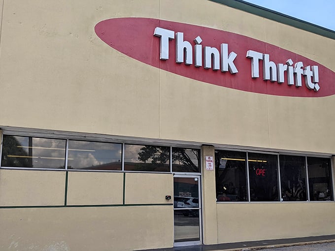 The unassuming exterior of Think Thrift Store in Lauderdale Lakes belies the treasure trove waiting inside. Florida's palm trees stand guard over this secondhand paradise.