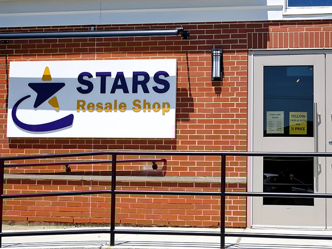 The charming brick facade of STARS Resale Shop welcomes bargain hunters with its distinctive blue and yellow signage, promising treasures waiting to be discovered inside.