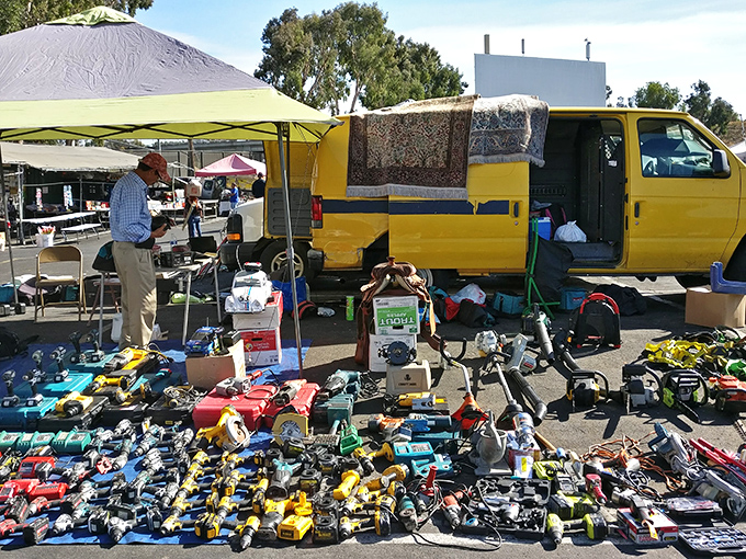 Tool paradise! One vendor's yellow van serves as command central for a dazzling array of power tools that would make Tim Allen weep with joy.