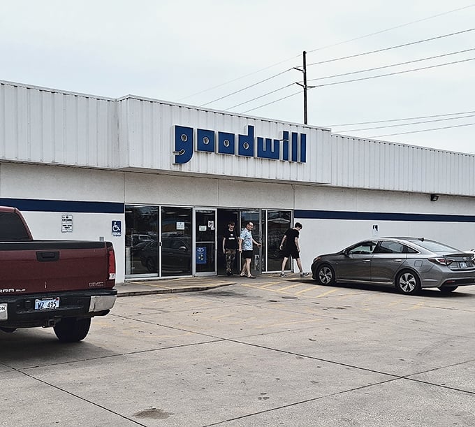 The iconic blue Goodwill sign beckons like a lighthouse for bargain hunters navigating the sea of retail options in Wichita.