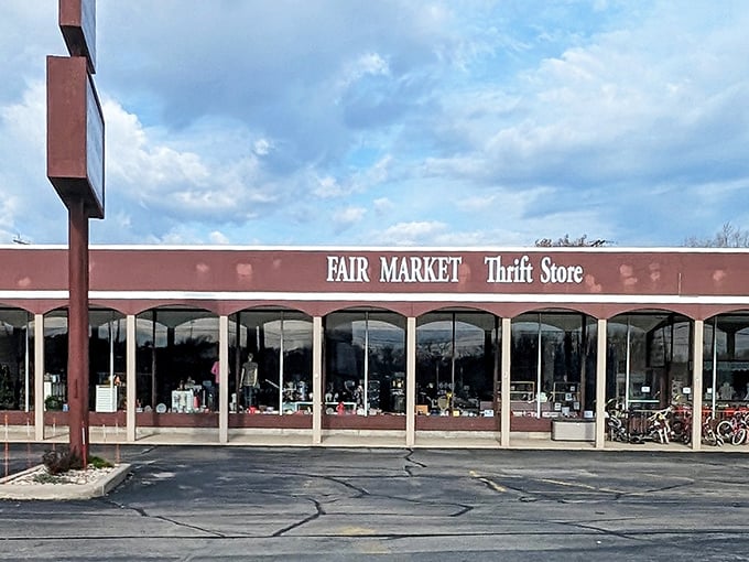 The unassuming storefront of Fair Market Thrift Store beckons with the promise of hidden treasures behind those large windows. Bicycles parked outside hint at local loyalty.