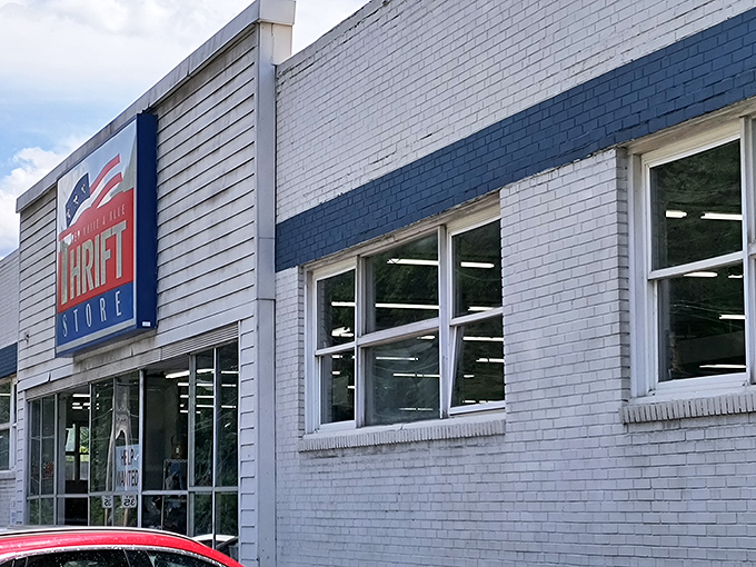 The patriotic facade of Red White & Blue Thrift Store stands as a monument to bargain hunting in Pittsburgh, where treasures await behind those unassuming doors.