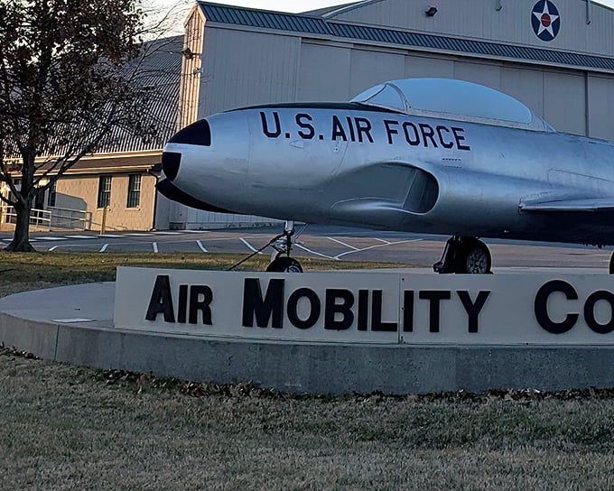 The sleek silhouette of a T-33 Shooting Star welcomes visitors to the Air Mobility Command Museum, like a metallic maître d' inviting you to the feast of aviation history.
