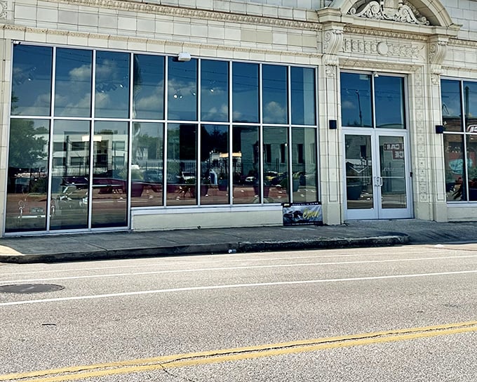 The Edge Motor Museum's elegant façade in Memphis blends historic architecture with modern glass, like a tailored suit waiting for automotive enthusiasts to step inside.