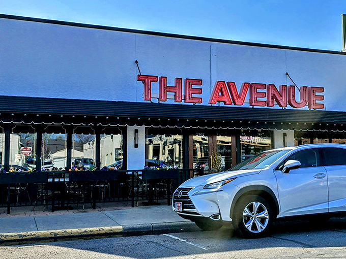 The Avenue's iconic red signage against crisp white walls isn't just a restaurant front—it's a beacon for carnivores with discerning taste buds.