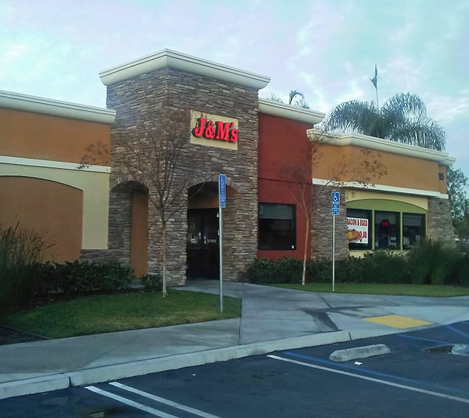 J & M’s stone facade stands like a beacon for hungry travelers, guiding them toward hearty comfort food just inside.