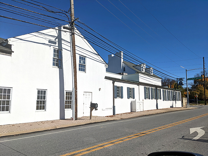 The unassuming white exterior of Blue Bell Inn hides culinary treasures within—like finding a Rolex in your grandmother's cookie jar.
