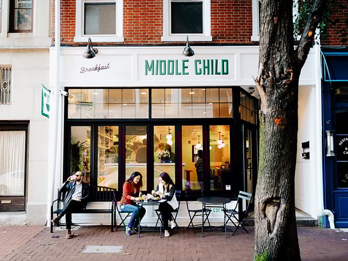 The charming storefront of Middle Child beckons with its crisp white facade and bold green lettering—Philadelphia's sandwich paradise hiding in plain sight.