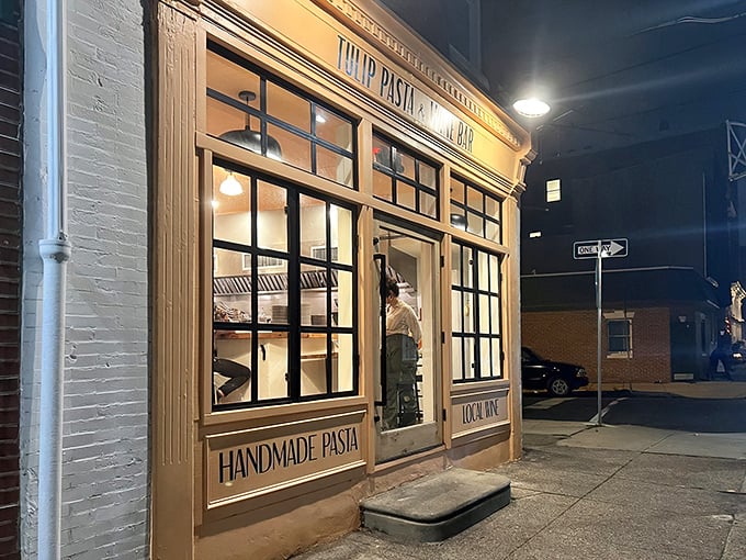 As night falls, this cozy pasta haven glows with invitation – the kind of place where memorable meals and conversations are born.