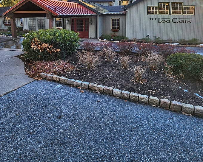 The unassuming sage-green exterior of The Log Cabin hides Pennsylvania's best-kept culinary secret, like finding a Rolex in a flannel shirt pocket.