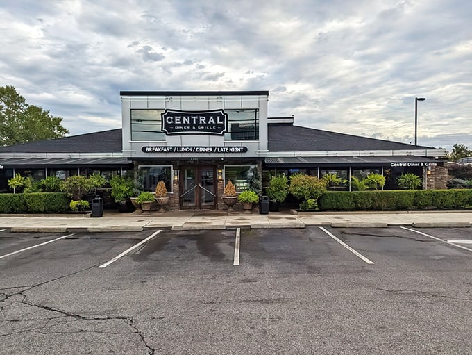 With its sleek glass front framed by lush greenery, Central Diner & Grille stands ready to serve comfort classics from sunrise to midnight.