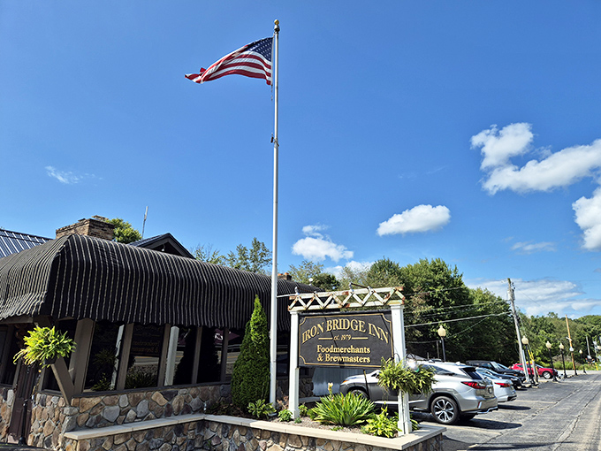 An American flag waves proudly above the Iron Bridge Inn, where Pennsylvania hospitality meets legendary prime rib.