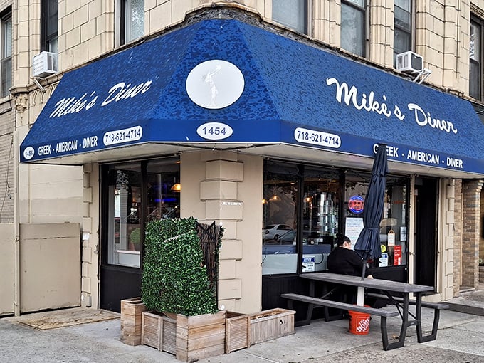That iconic blue awning marks the spot where Brooklyn's breakfast dreams come true—no frills, just perfect pancakes waiting inside.