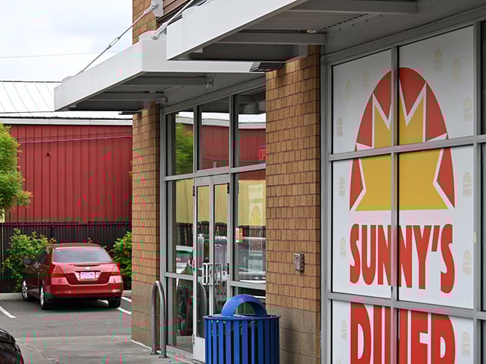 The sunshine-yellow brick exterior of Sunny's Diner stands like a beacon of breakfast hope against Oregon's famously fickle sky.