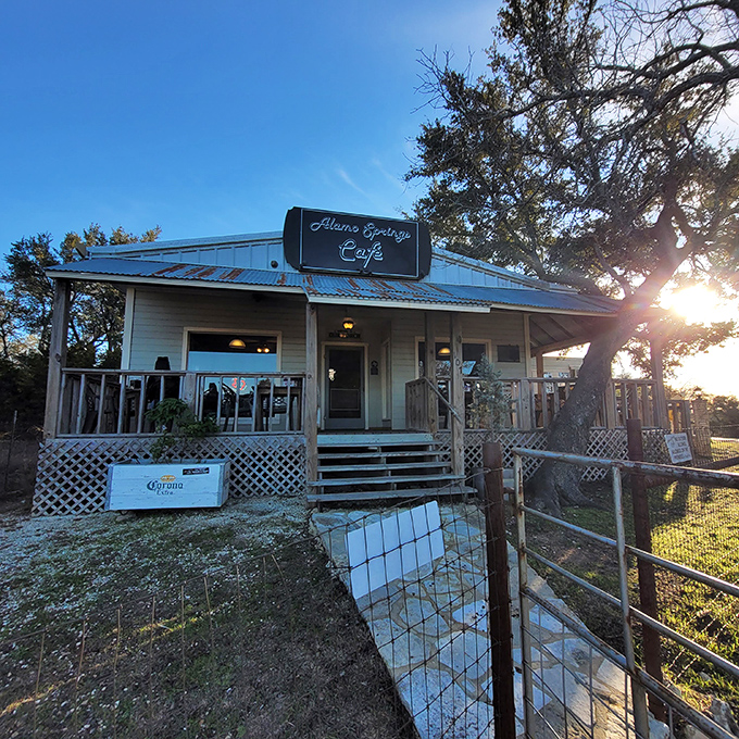 The quintessential Texas Hill Country hideaway – rustic charm under shade trees with a metal roof that's weathered more stories than a country song.
