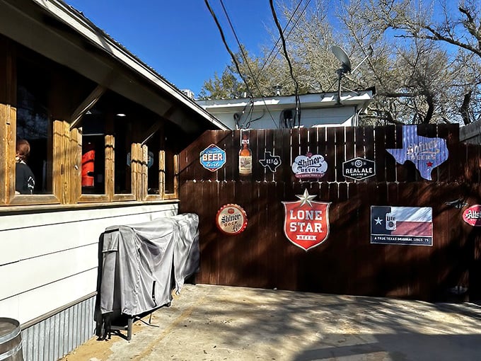 Texas beer pride adorns the outdoor area, where Lone Star and Shiner signs create the perfect backdrop for post-burger relaxation.