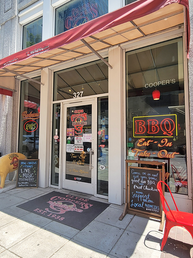 The classic diner counter setup – where strangers become friends over shared plates of Eastern-style barbecue and stories flow as freely as sweet tea.