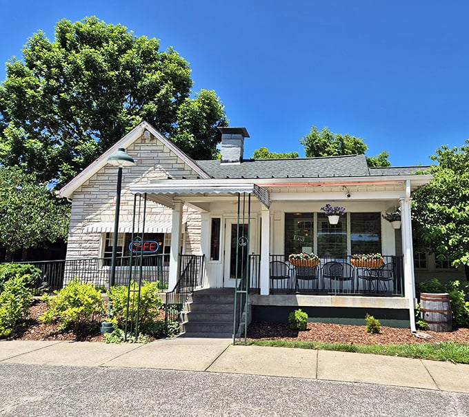 The charming white facade of The Loveless Cafe welcomes visitors like an old friend who happens to make the best biscuits in Tennessee.