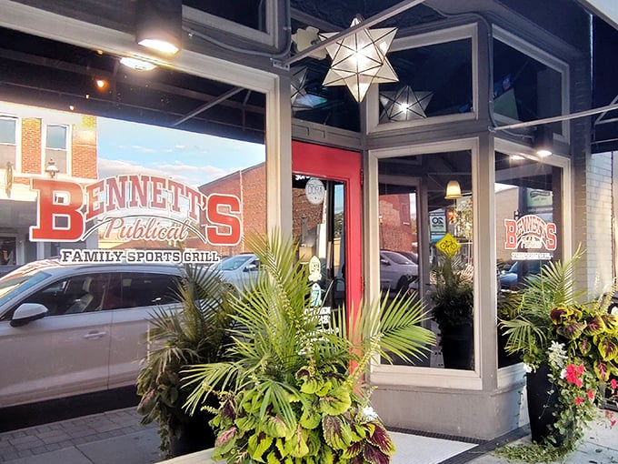 Bennett's welcoming storefront beckons with its distinctive red signage and lush greenery—like a friendly neighbor inviting you over for the good stuff.