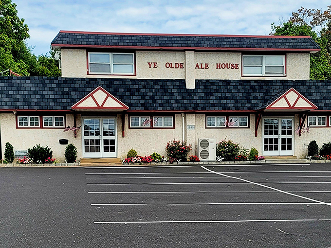 The unassuming Tudor-style exterior of Ye Olde Ale House stands like a humble guardian of culinary treasures. No fancy frills, just honest food awaiting inside.