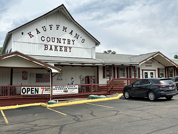 The white barn-style exterior of Kauffman's Country Bakery stands as a beacon of baked brilliance in Millersburg, promising sweet treasures within. Open seven days—because dessert emergencies don't take weekends off.