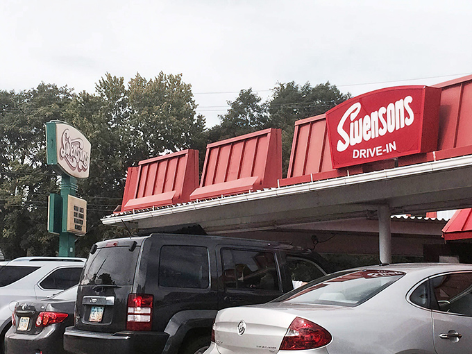 The iconic red roof of Swensons beckons like a beacon of burger bliss, promising a taste of Americana that's survived the fast-food revolution unscathed.