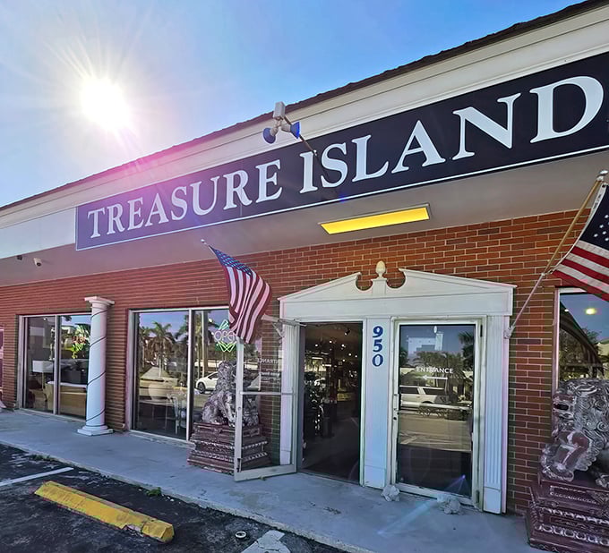 The sun-drenched façade of Treasure Island Antiques beckons with patriotic flair, promising air-conditioned adventures through decades of American nostalgia.