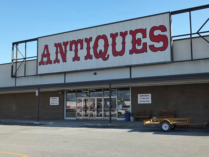 That bold red "ANTIQUES" sign beckons treasure hunters like a lighthouse guides ships to shore.