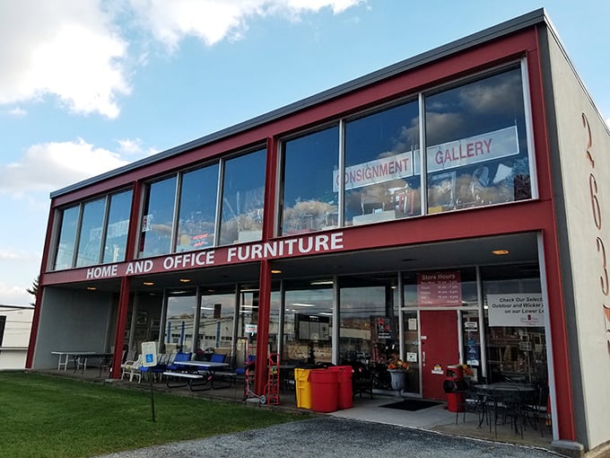 This bold, crimson-framed consignment gallery rises like a giant display case — step inside and you’ll find a trove of home and office furniture bargains waiting to be discovered.