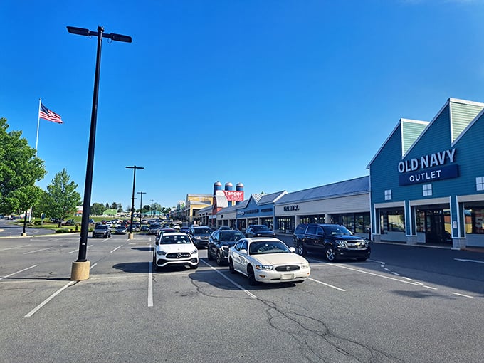 The distinctive green-gabled buildings of Tanger Outlets Lancaster stand like beacons of bargain hope, welcoming shoppers to a retail paradise nestled in Amish country.