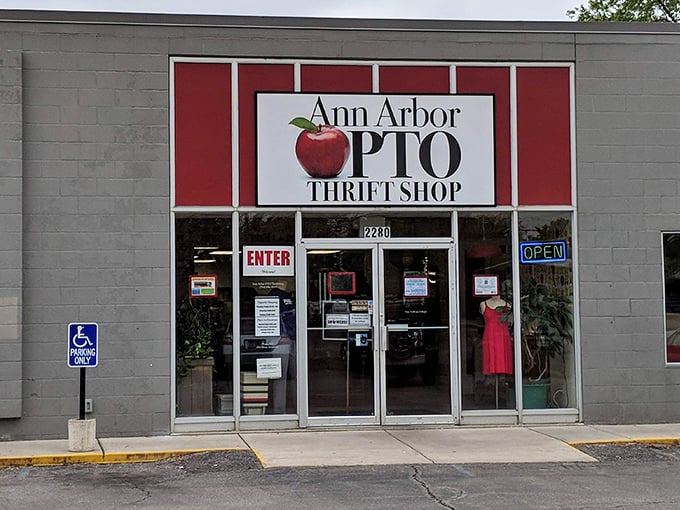 The unassuming gray exterior with its bright red-framed apple logo promises treasures within—like finding a diamond mine disguised as a garden shed.