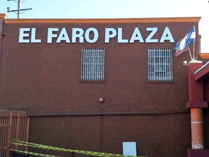 The terracotta-colored exterior of El Faro Plaza stands like a beacon for bargain hunters, its iconic lighthouse logo promising treasures within.