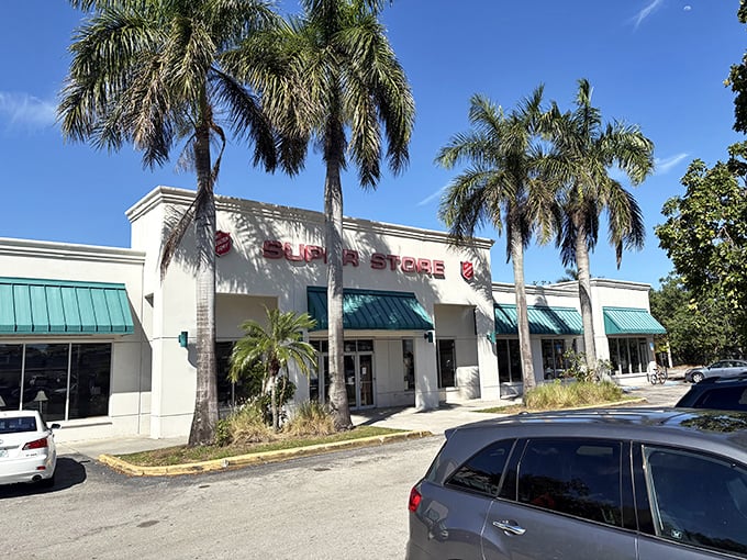 Palm trees stand guard outside this treasure trove like tropical bouncers at Florida's most exclusive secondhand club. The turquoise awnings practically wink at passersby.