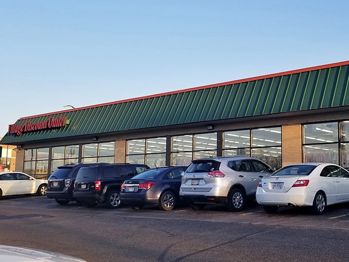 The iconic green roof and red signage of Village Discount Outlet—retail's version of finding money in your winter coat pocket.