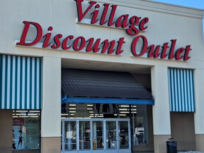 The iconic red signage of Village Discount Outlet beckons bargain hunters like a lighthouse for the thrift-obsessed. Those blue and white awnings practically wave hello!