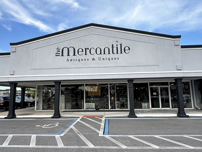 The elegant storefront welcomes treasure hunters with classic columns and a promise of "Antiques & Uniques"—an understatement if there ever was one.