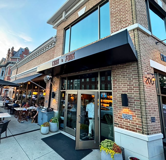 The brick façade of Cork & Fork stands proudly on a Harrisburg corner, promising culinary adventures within those welcoming glass doors.