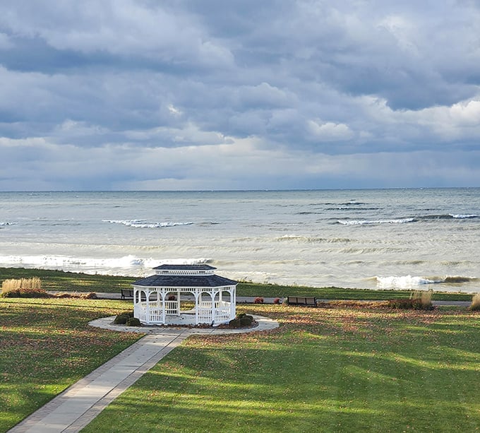Mother Nature's mood ring on full display—Lake Erie's dramatic skies frame a picture-perfect gazebo, where countless "I do's" and sunset selfies have been immortalized.