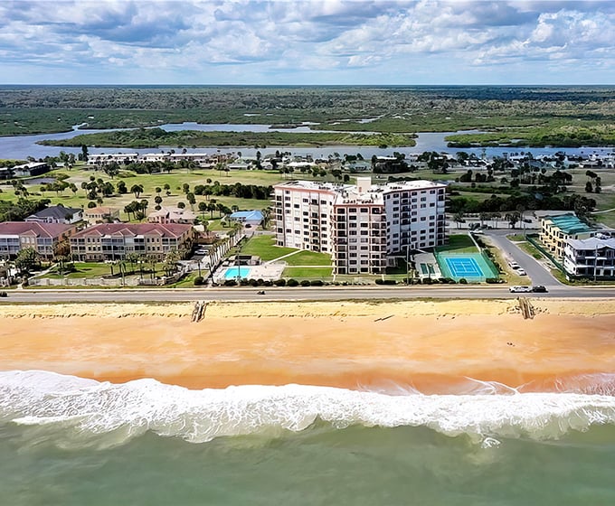 The signature orange-hued sands of Flagler Beach create a stunning contrast with the emerald Atlantic waters and inland waterways.