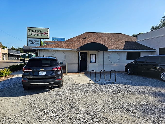 The modest exterior of Trip’s Diner proves that true Florida gems don’t need flash—just hearty comfort food that keeps you coming back.