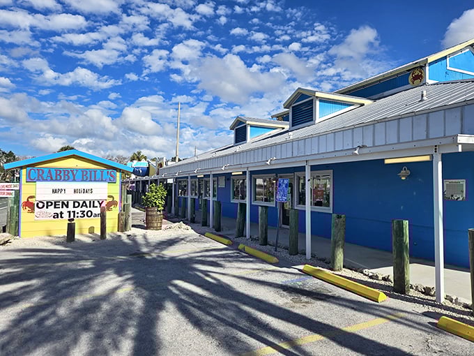 The iconic red-roofed sign at Crabby Bill's announces "THE CRAB IS BACK" – as if these delicious crustaceans ever left this Florida seafood haven.