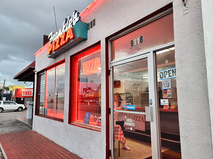 That iconic turquoise and yellow sign has been beckoning hungry Miamians for generations – a beacon of square pizza perfection on Bird Road.